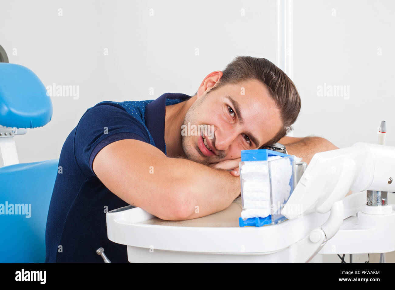 Crazy patient sitting in a dental chair Stock Photo - Alamy