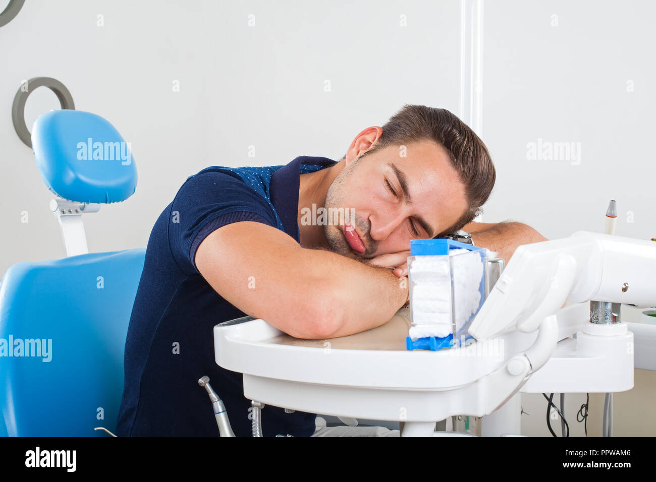 Crazy patient sitting in a dental chair Stock Photo - Alamy