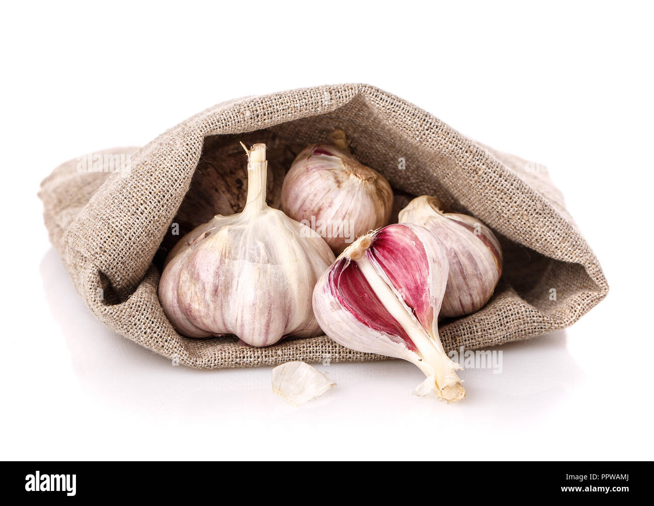 Garlic in a bag. Isolated on a white background Stock Photo - Alamy