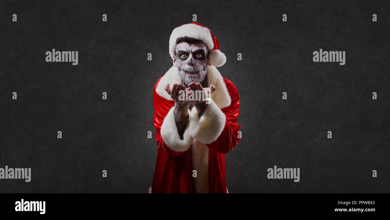Santa Claus is a wizard with a skull on Christmas Stock Photo - Alamy