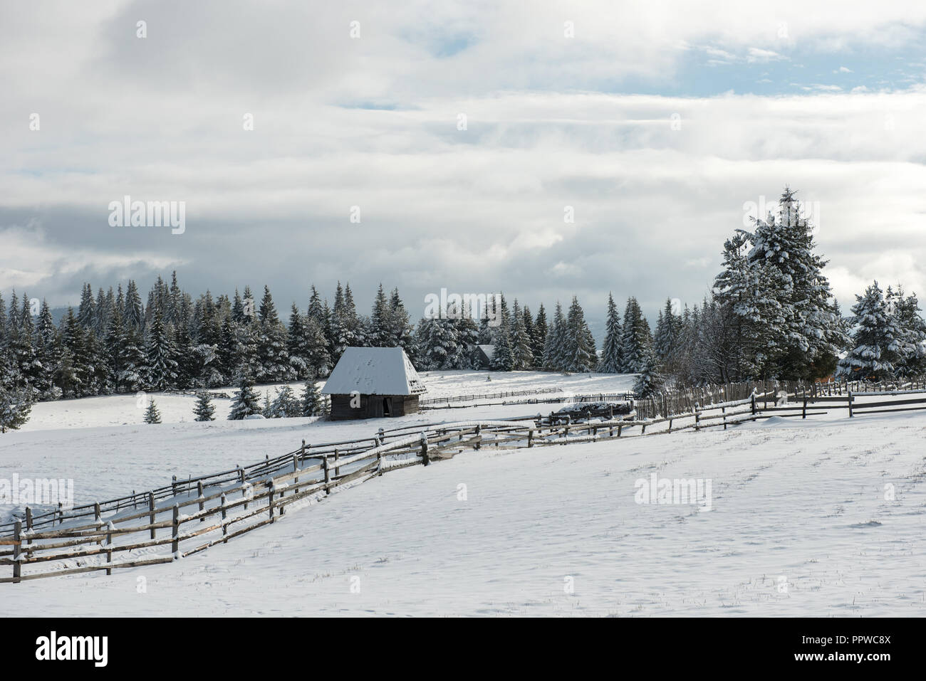 Idyllic winter wonderland mountain scenery with mountain chalet, lodge ...