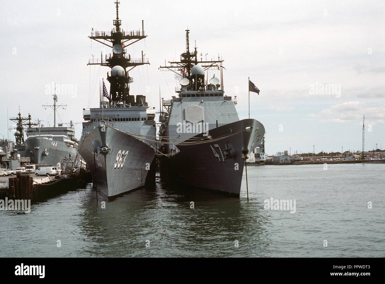 Bow view of USS Spruance (DD-963) and USS Ticonderoga (CG-47) at Naval ...