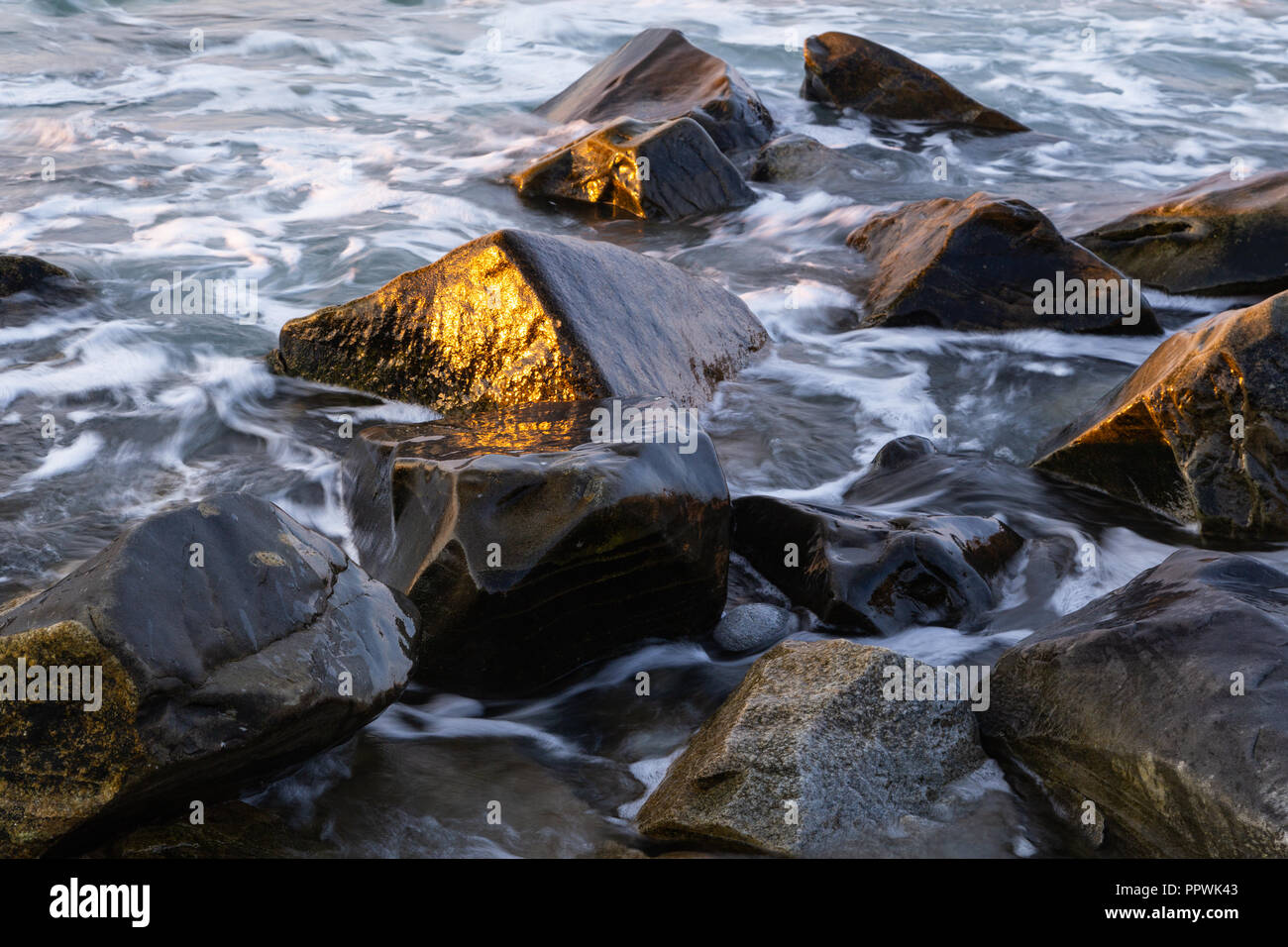 Smooth seaside during golden hour hi-res stock photography and images ...