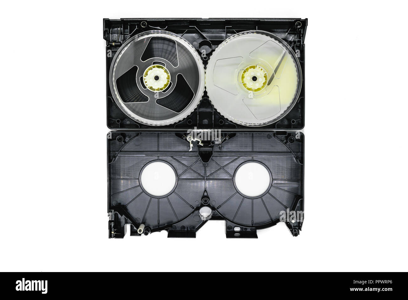 Background surface of inside open video home system VHS tape reels and ...