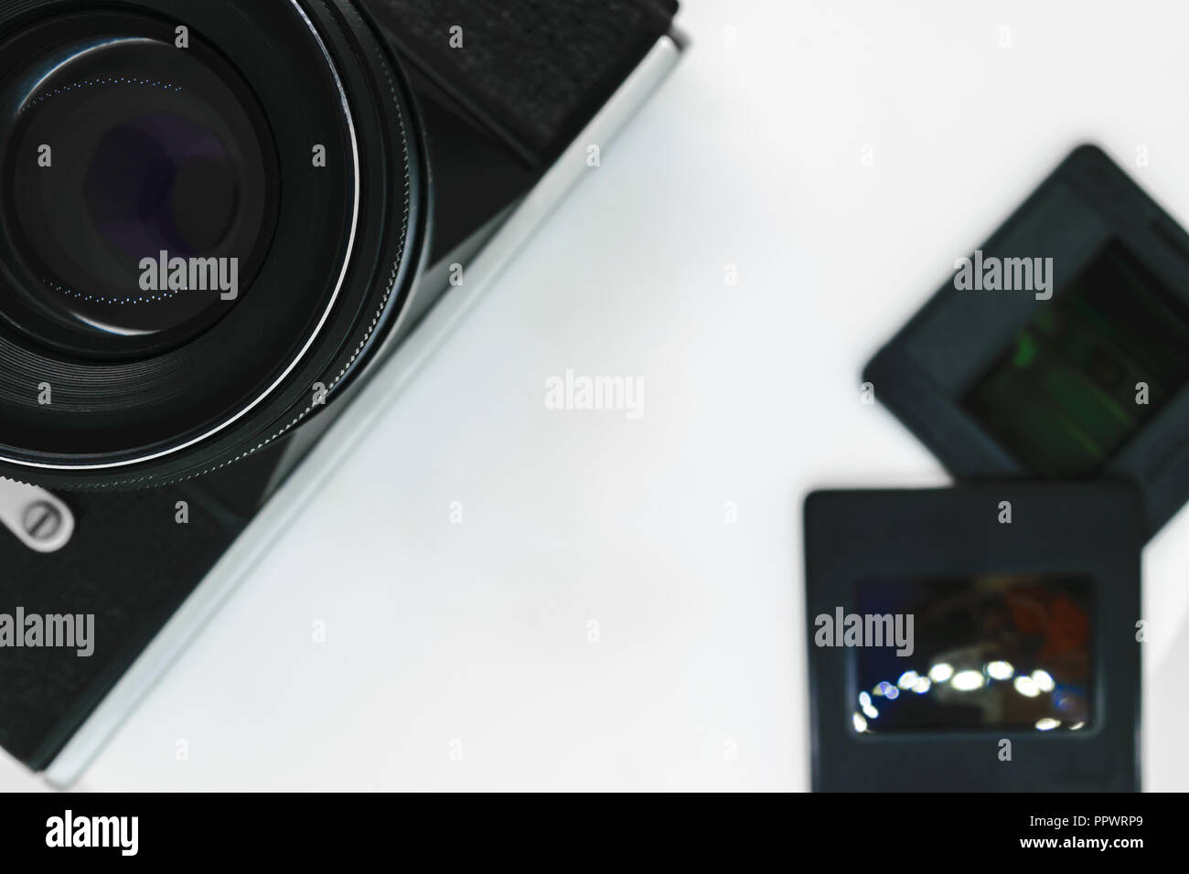 Very old vintage black photo camera with black lens view from top with ...