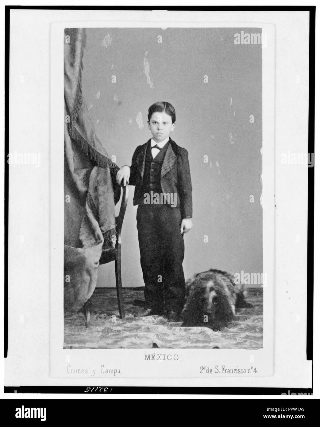 Boy wearing suit, full-length portrait, standing, facing front Stock ...