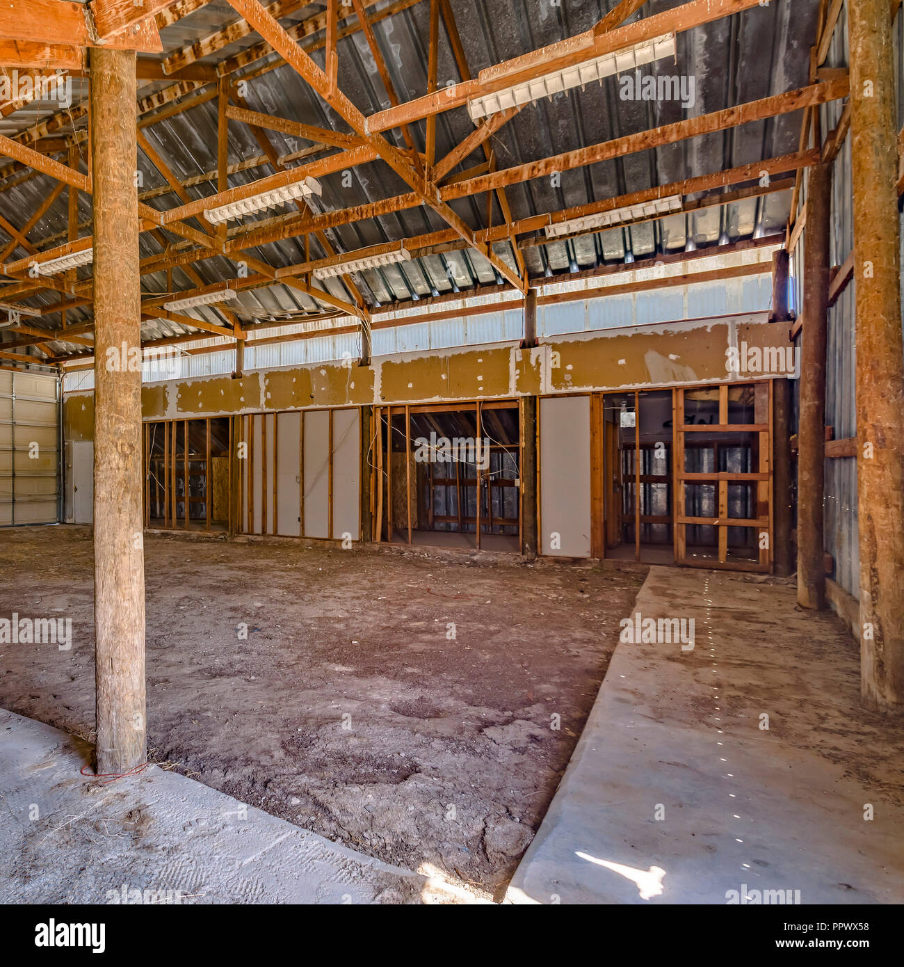 Interior view of an empty aged barn Stock Photo - Alamy