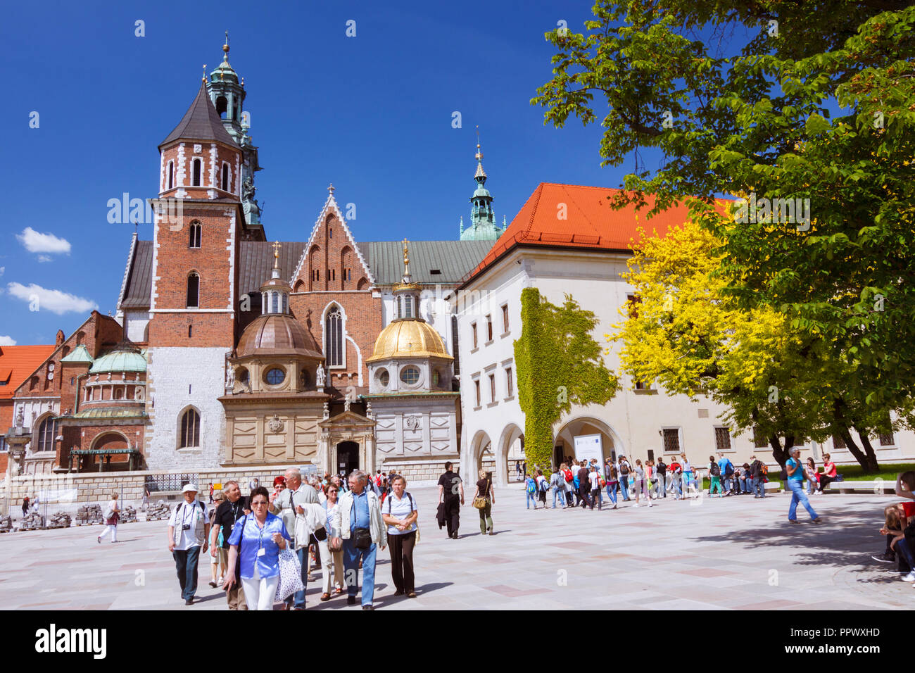 Krakow, Poland : Tourists walk around Wawel Cathedral on the Wawel Hill ...