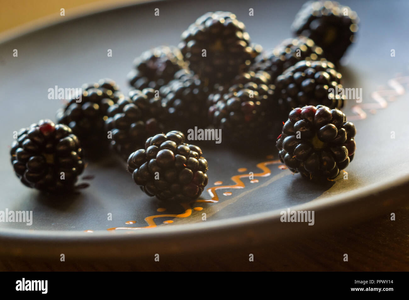 large juicy fresh blackberry berries on a ceramic plate, close-up Stock ...