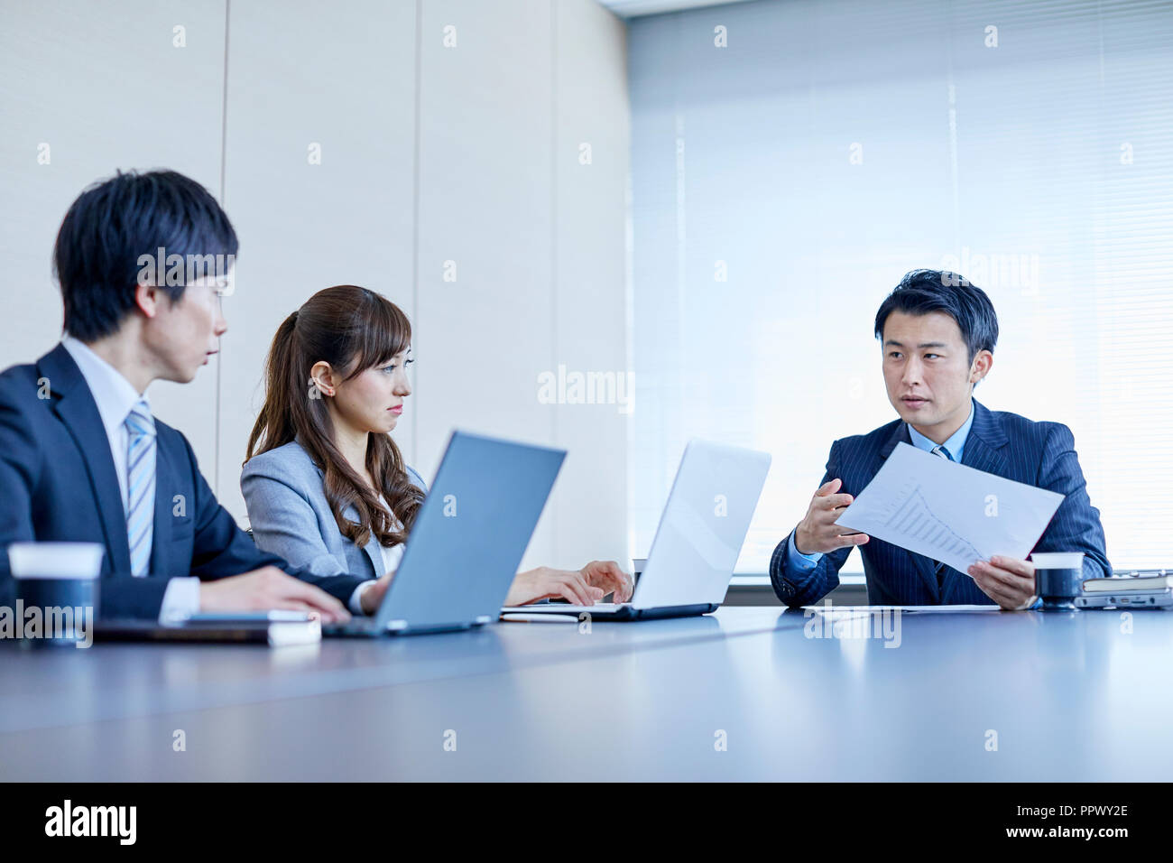 Japanese businesspeople in a meeting Stock Photo - Alamy