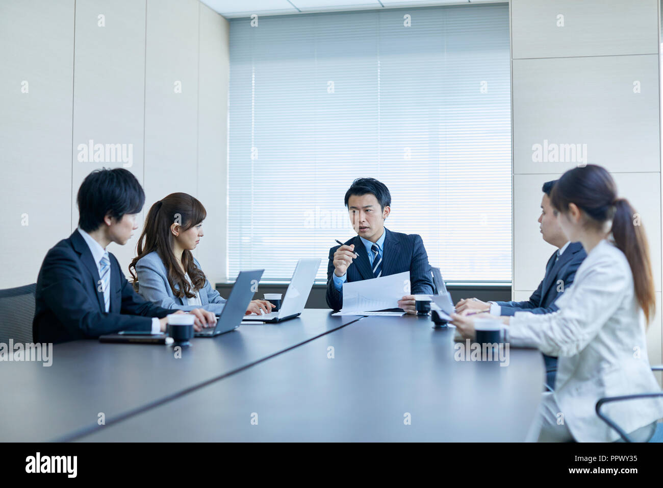 Japanese businesspeople in a meeting Stock Photo - Alamy