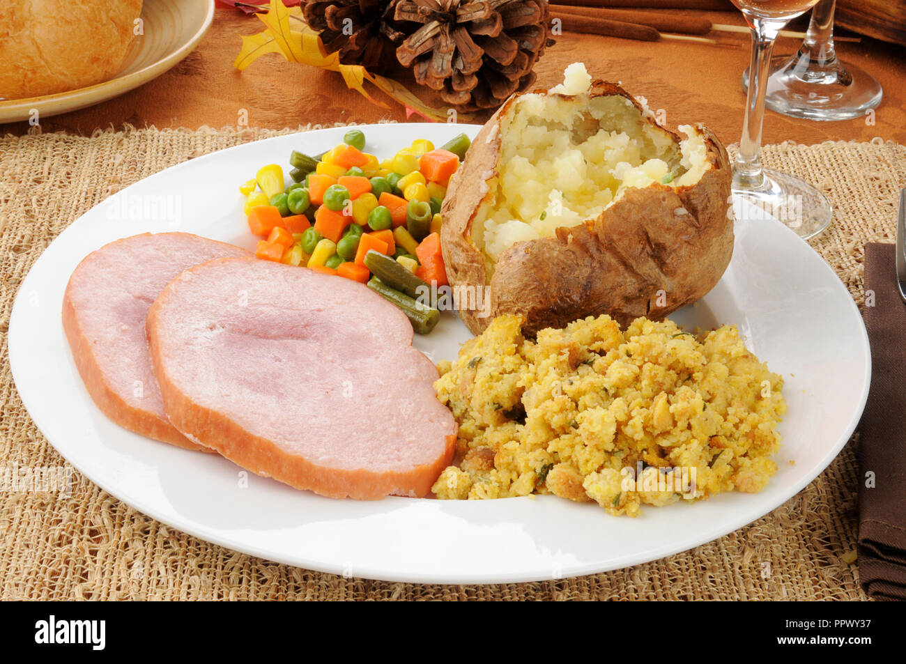 A ham dinner on a Thanksgiving dinner table Stock Photo - Alamy
