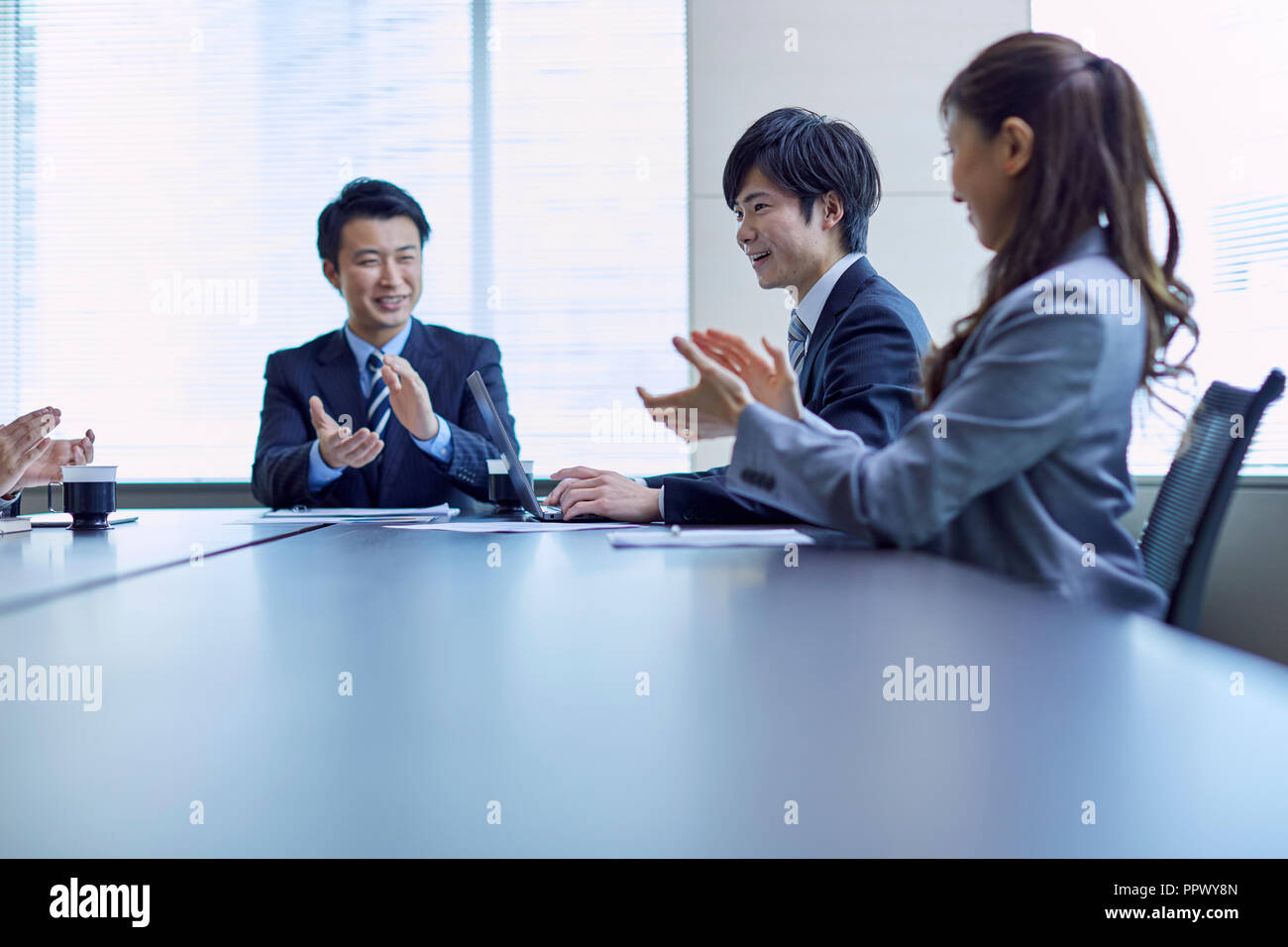 Japanese businesspeople in a meeting Stock Photo - Alamy