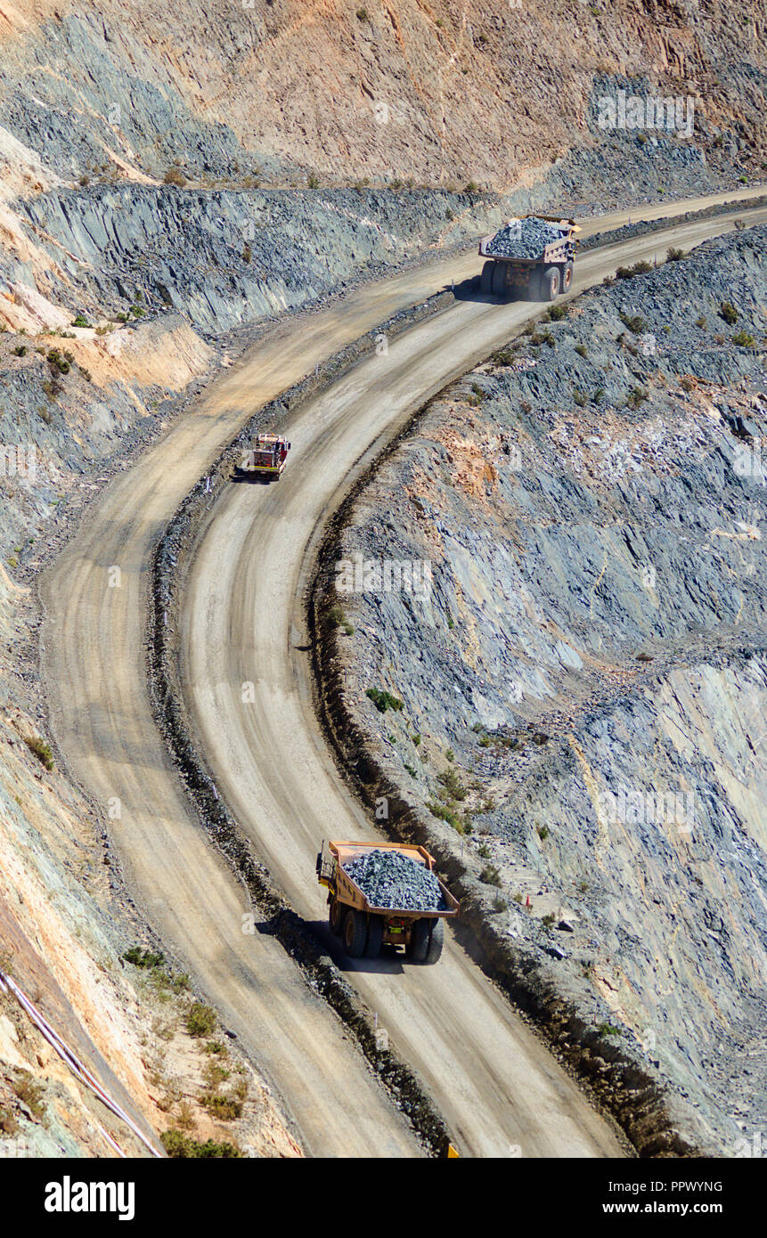 Truck carting ore from open pit mine up ramp for processing. Western ...