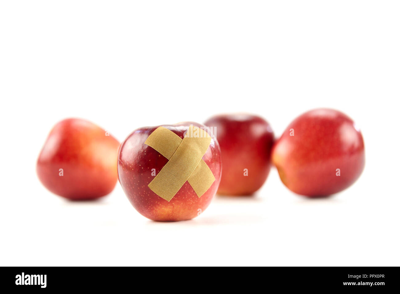 red apple with bandage isolated on white background Stock Photo - Alamy