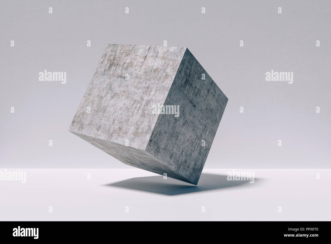 3d concrete cube against concrete wall Stock Photo - Alamy