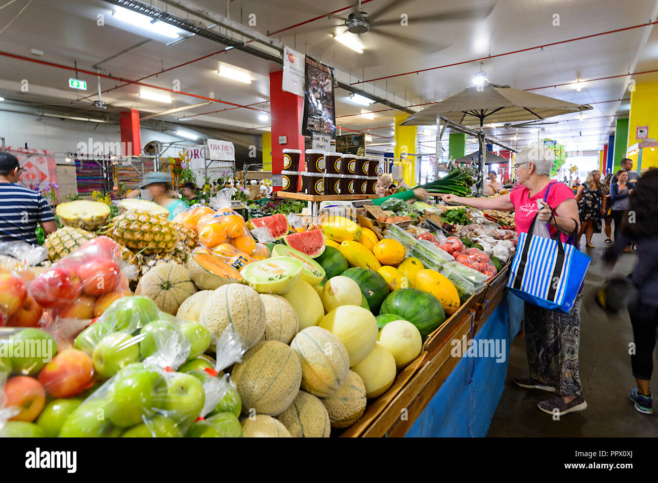 Customer buying fresh produce at the popular Rusty's Market on Sheridan ...