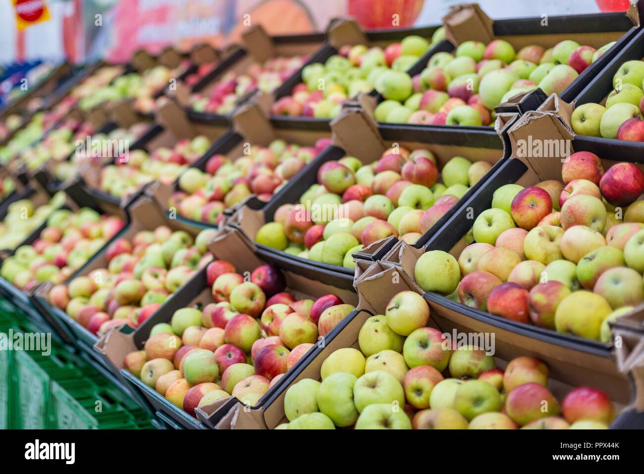Fresh delicious apples on retail display in supermarket store Stock ...