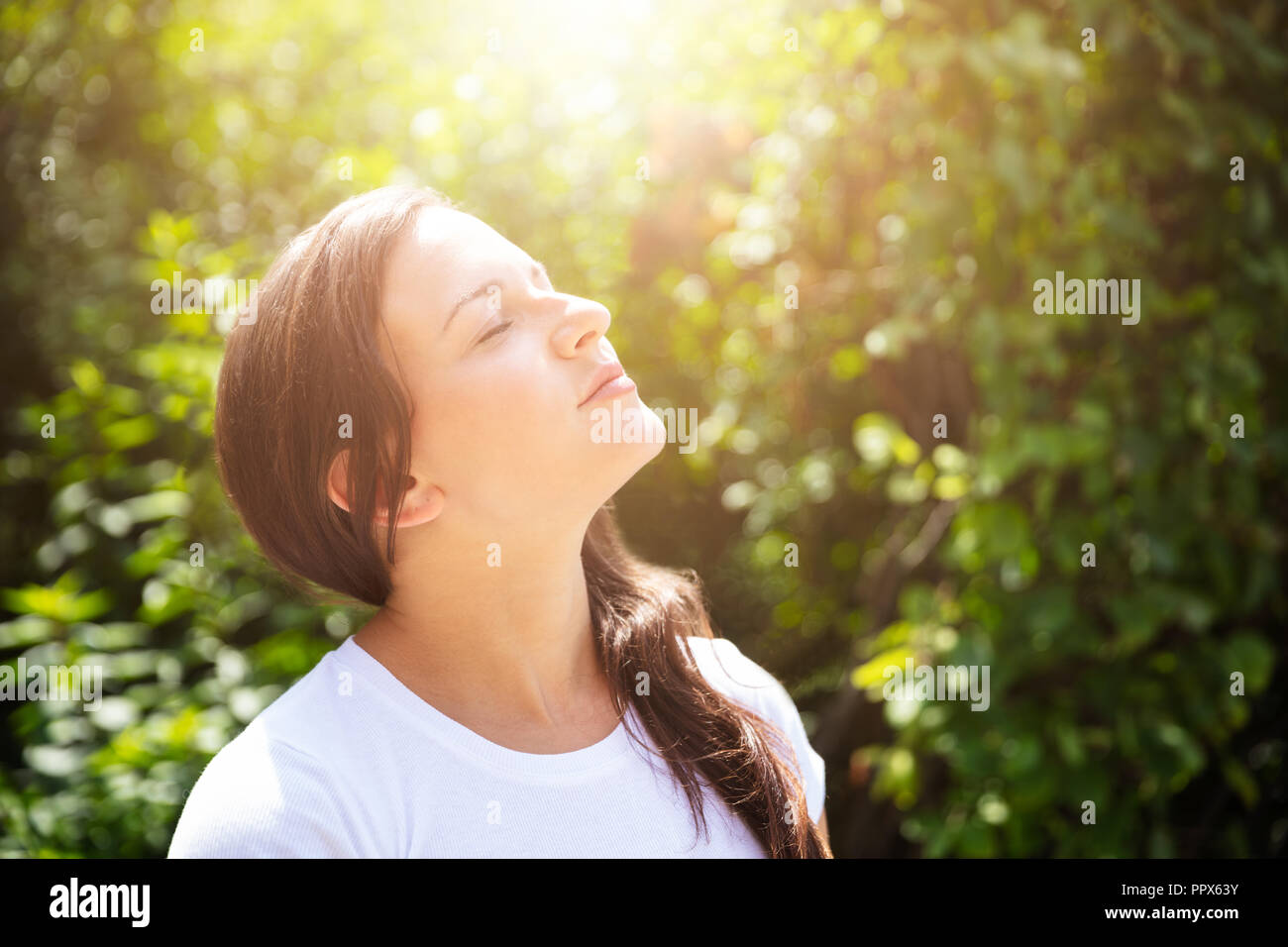Close-up Of A Beautiful Young Woman Closing Her Eyes Stock Photo - Alamy