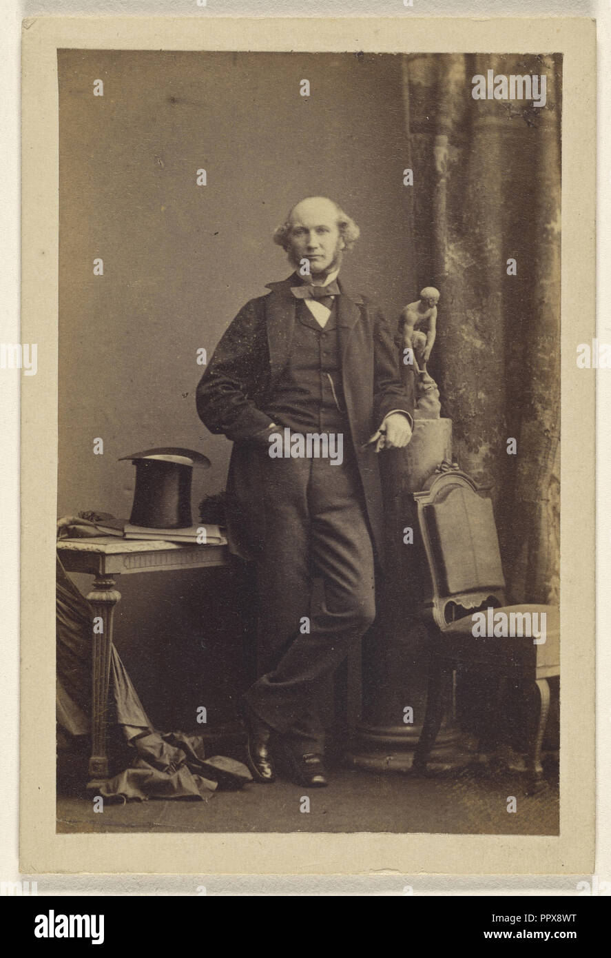 man standing, top hat on table; Camille Silvy, French, 1834 - 1910 ...