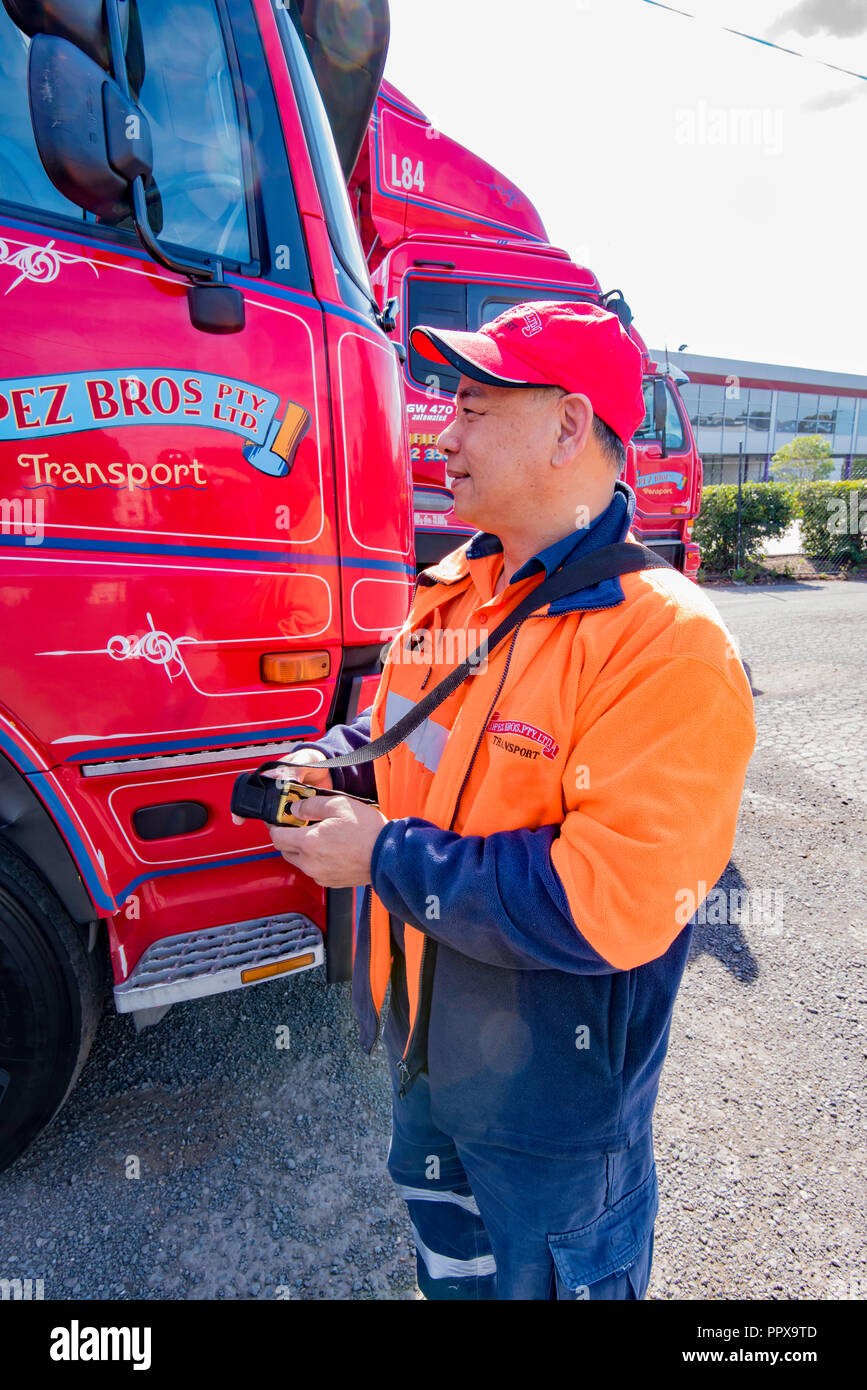 A Vietnamese born, Australian truck driver uses a remote device to ...