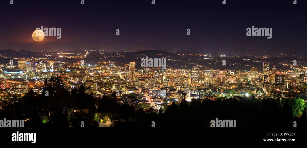 Downtown Portland, Oregon at night with full moon from Pittock Mansion ...