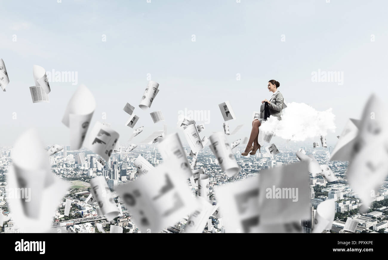Woman float above city on cloud and papers flying around Stock Photo ...
