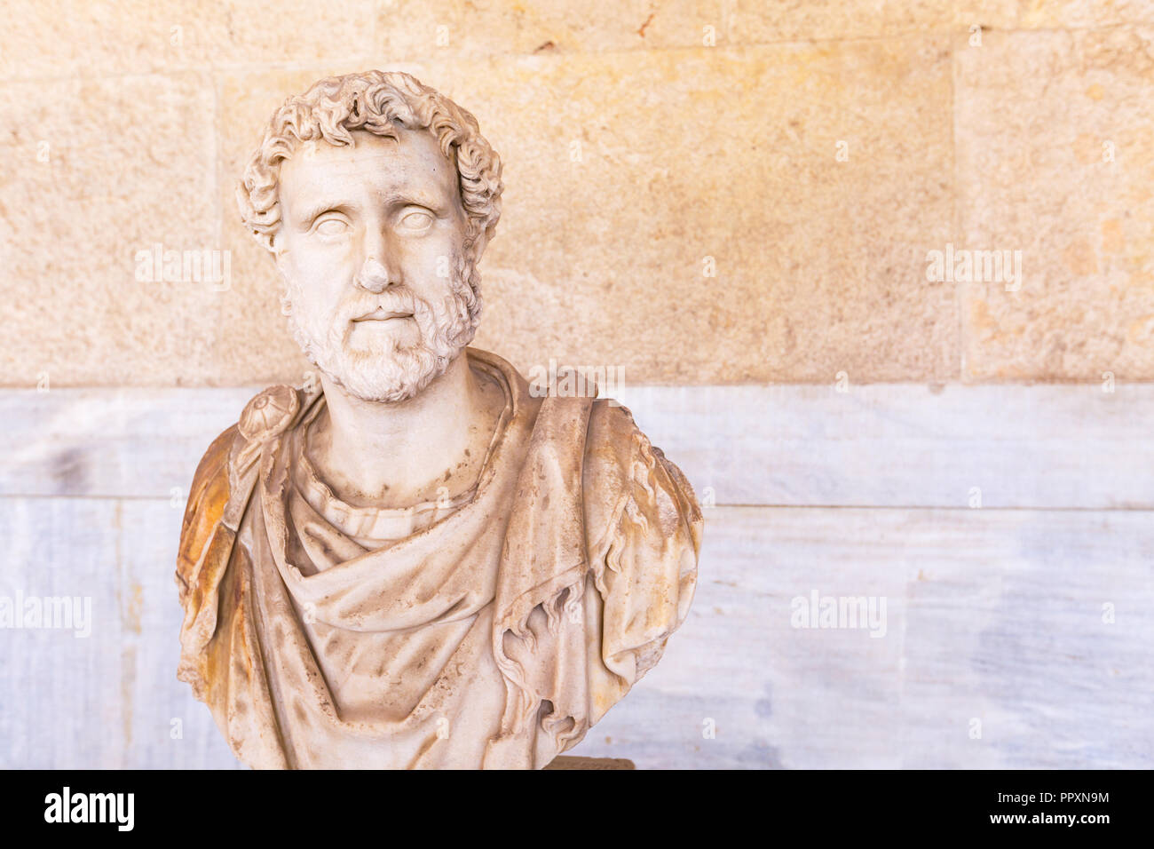 Bust statue of Roman emperor Antoninus Pius inside the Stoa of Attalos ...