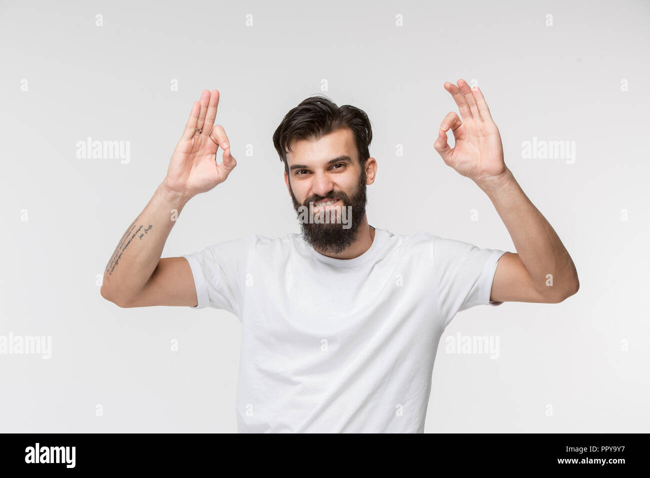 I am ok. Happy businessman, sign ok, smiling, isolated on white studio ...