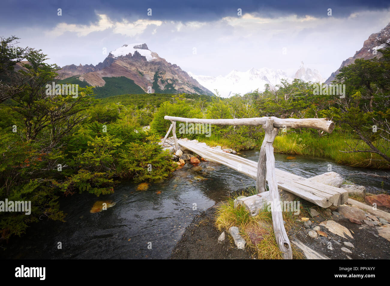 Bridge over creek on trailway at foot of Andes mountains, Santa Cruz ...