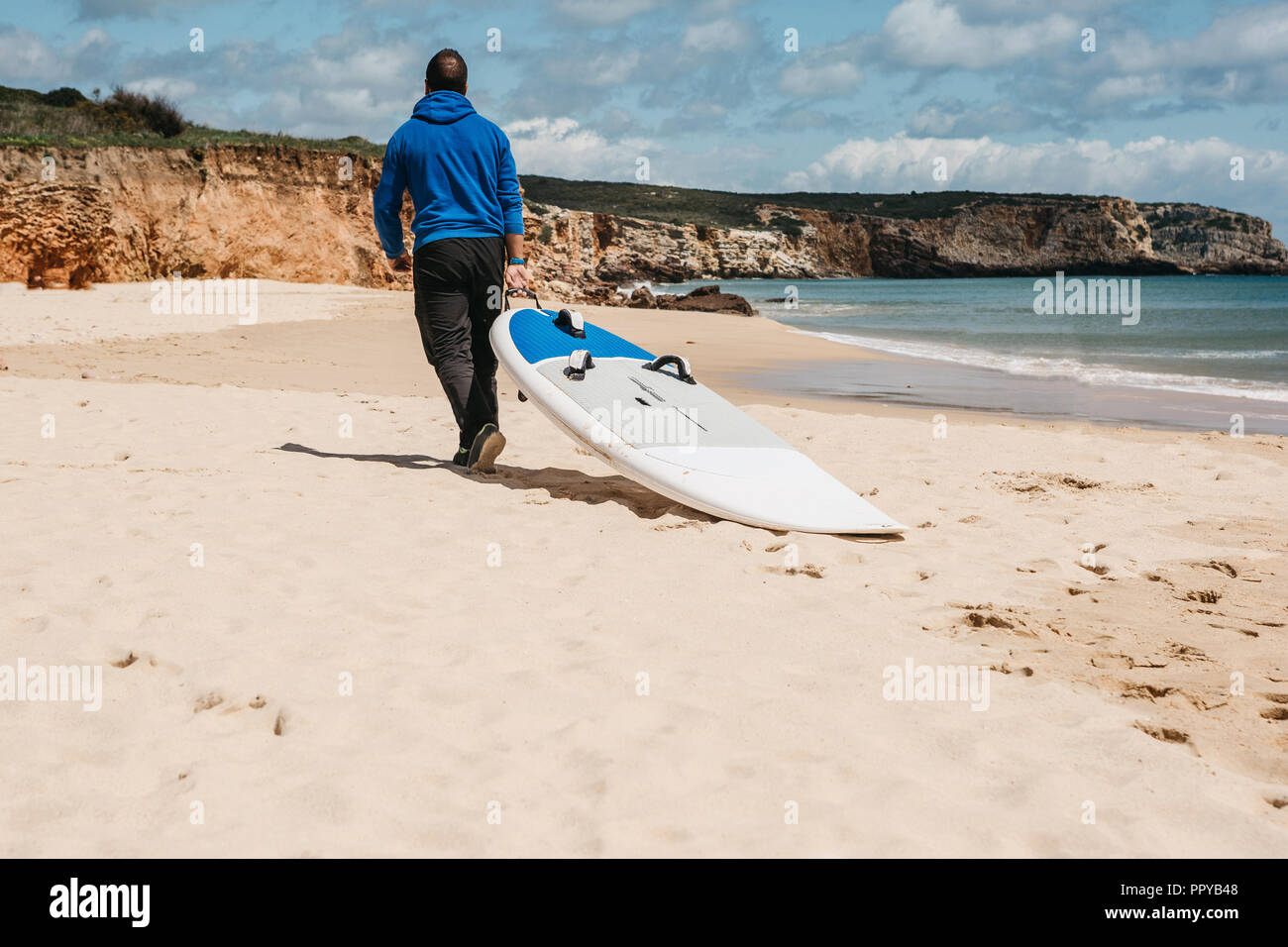 Carry surfboard hi-res stock photography and images - Alamy
