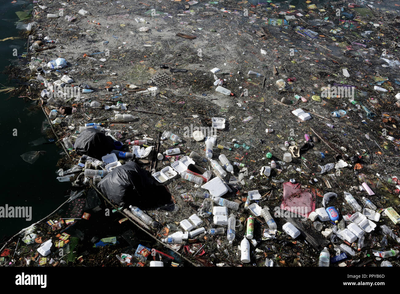 Plastic bottles, plastic bags, polystyrene and other trash floating on ...