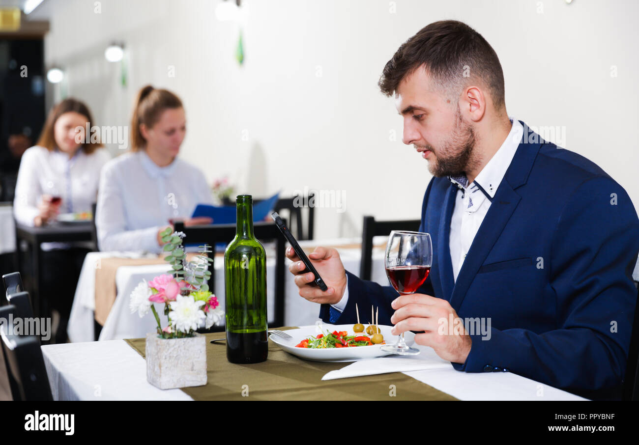 Gentleman is having dinner in luxury restaurante indoor Stock Photo - Alamy