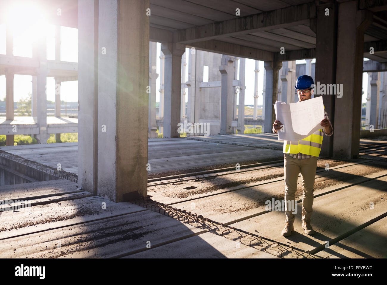 Engineers working on a building site Stock Photo - Alamy