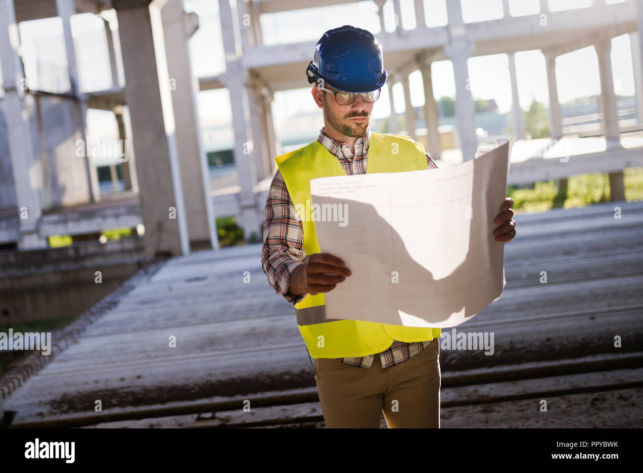 Engineer worker checking blueprint work hi-res stock photography and ...
