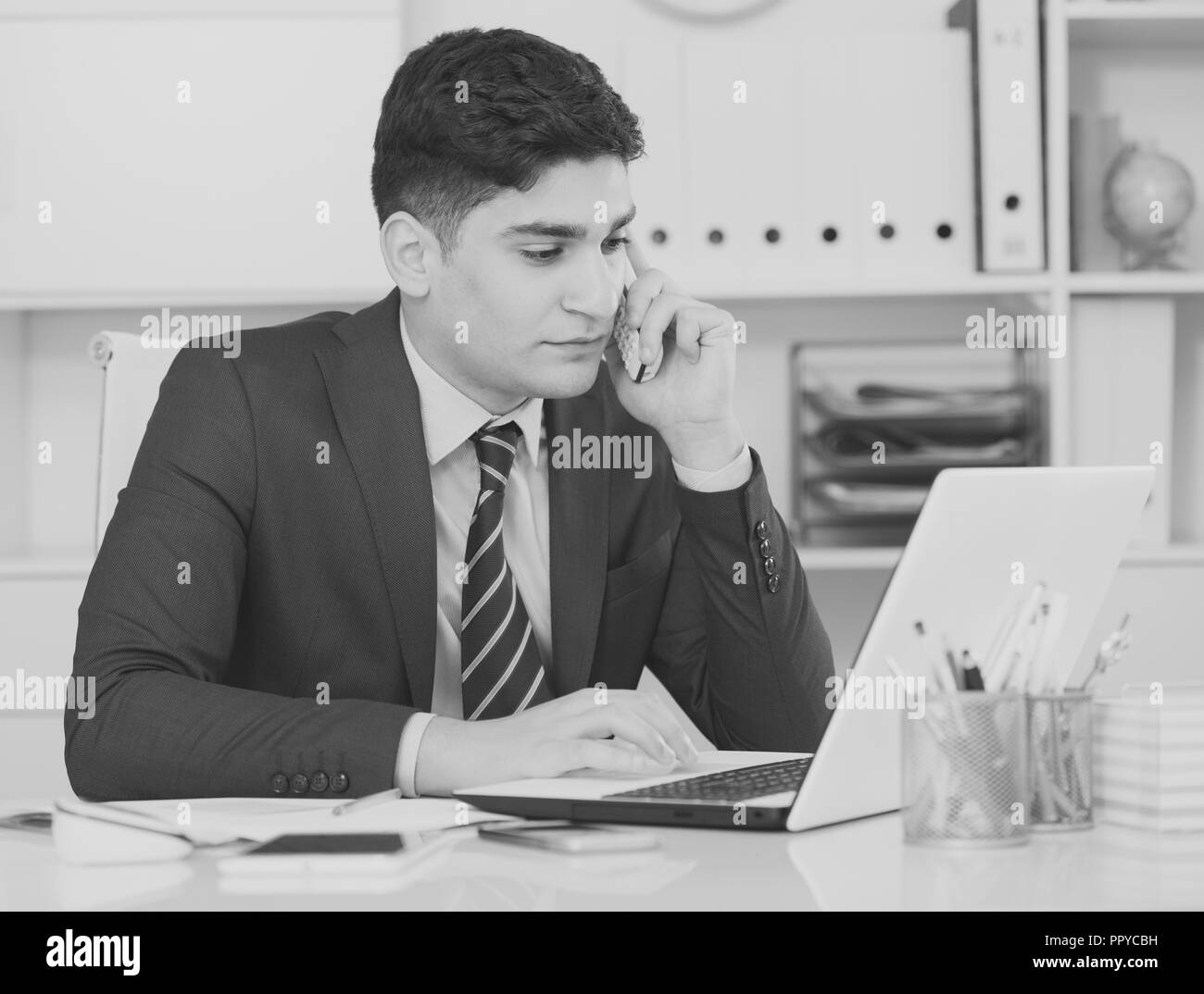 Calculating young adult Black and White Stock Photos & Images - Alamy