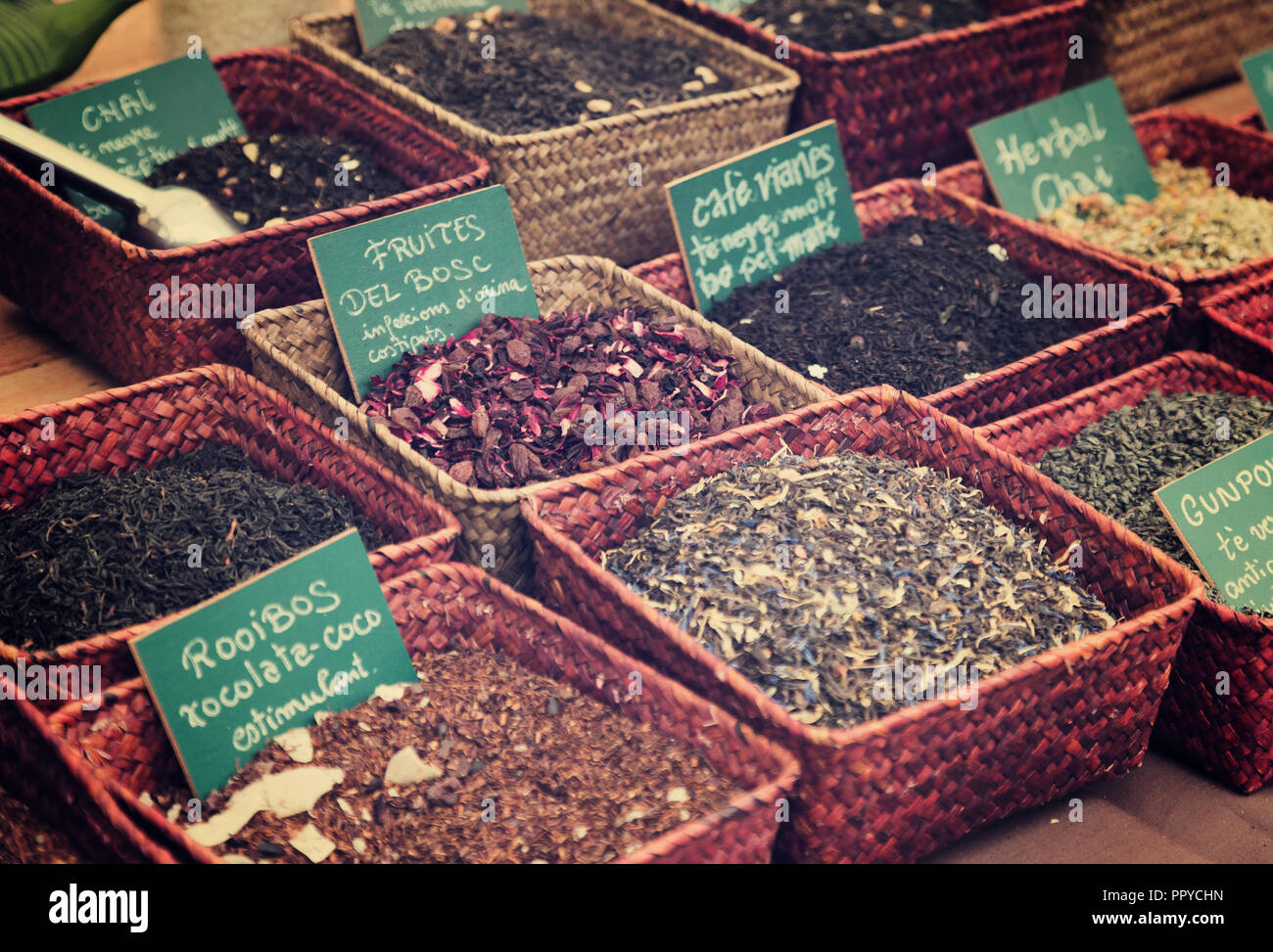 Baskets with different herbs and tea in spanish market Stock Photo - Alamy