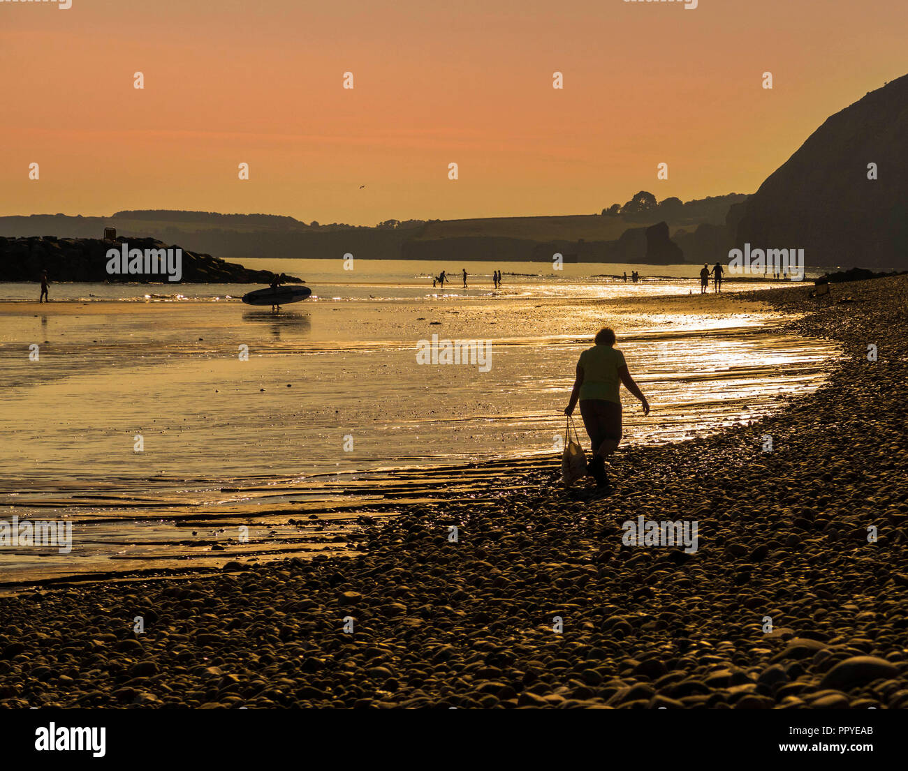 Sunset falls on Sidmouth beach, Devon, UK Stock Photo - Alamy