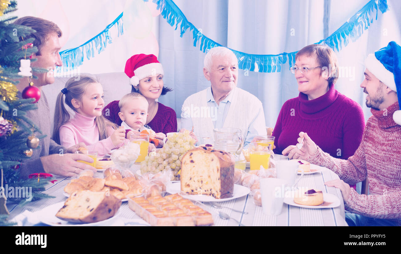 People are engaging in dialog during celebration Christmas Stock Photo ...