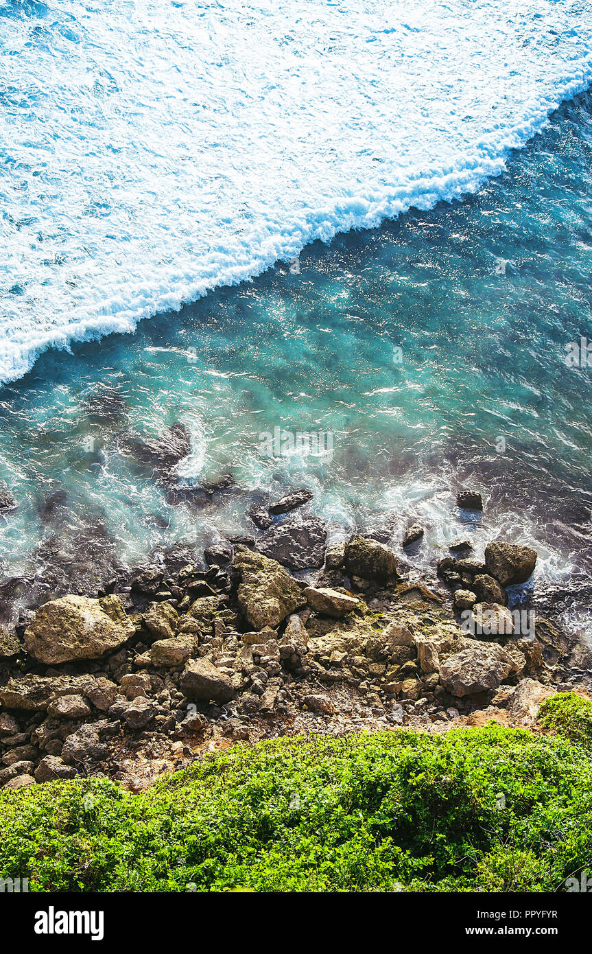 Sea landscape background, water with waves and rock, top view of the ...