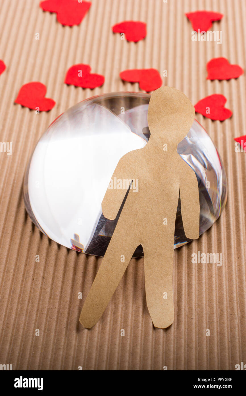 Man shape cut out of paper on paper background Stock Photo - Alamy