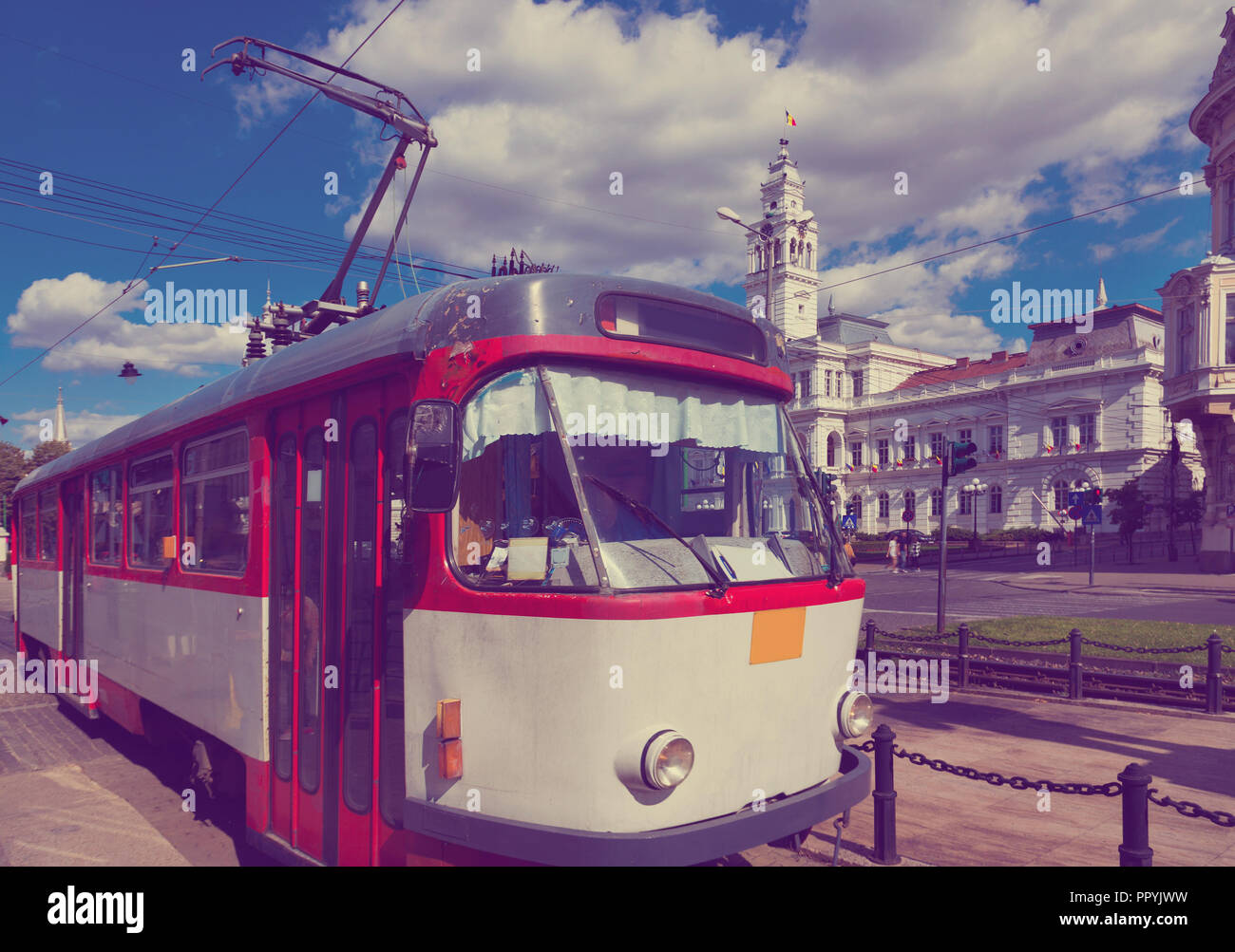 Colored trams running on main square near Arad city hall, Romania Stock ...