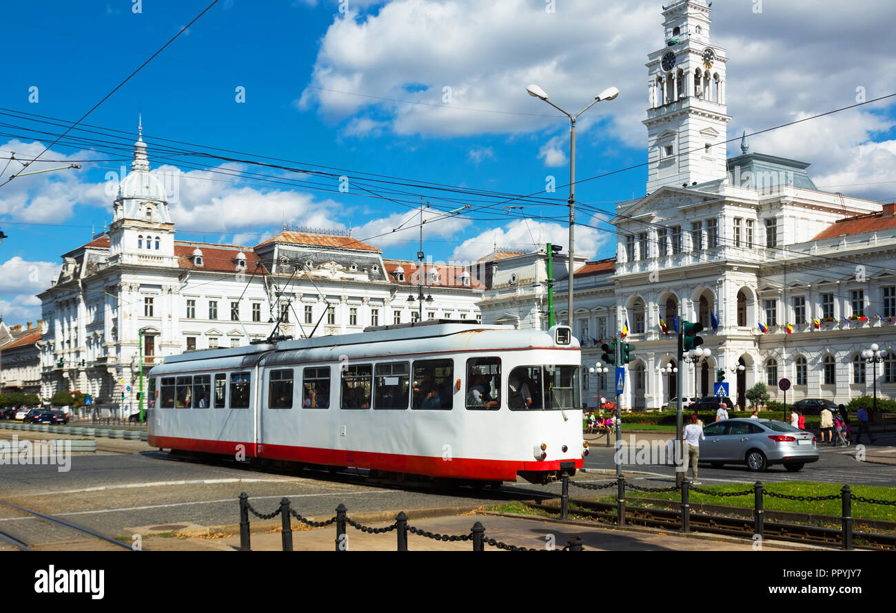 Colored trams running on main square near Arad city hall, Romania Stock ...