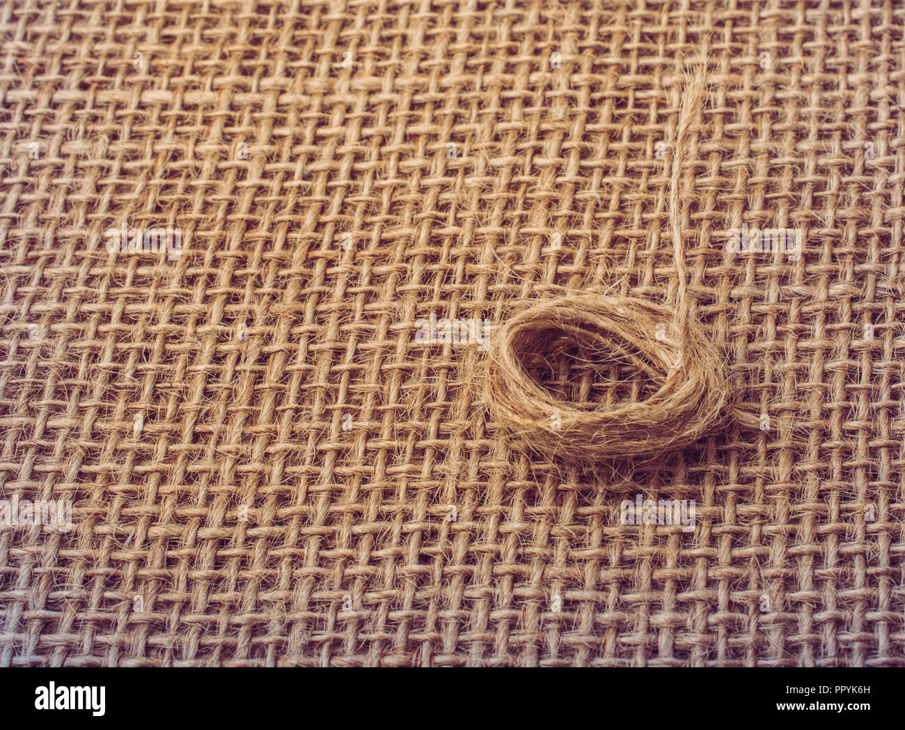 Roll of brown color linen string paper background Stock Photo - Alamy