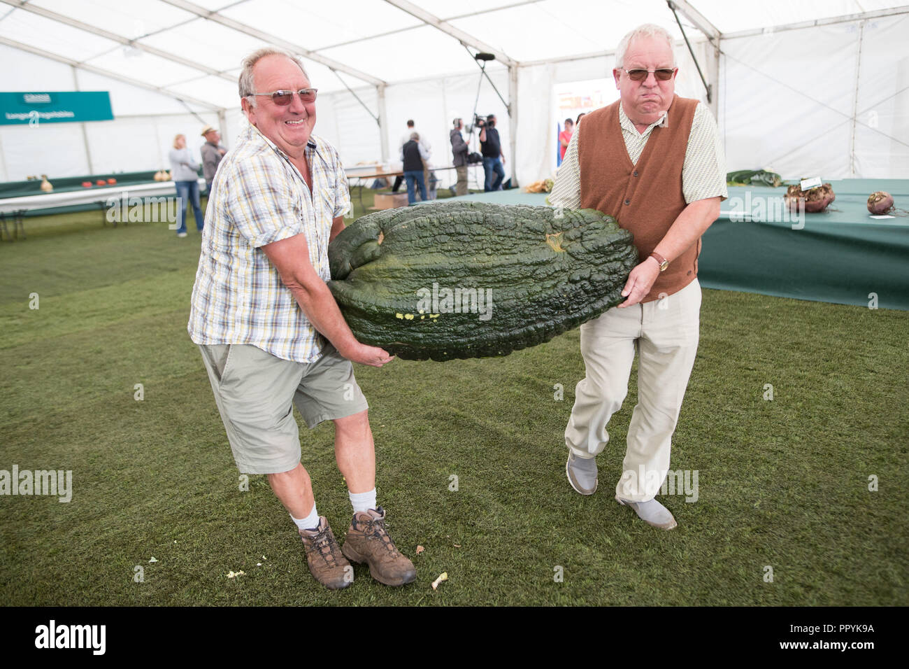 A marrow is carried into the CANNA UK National Giant Vegetables ...