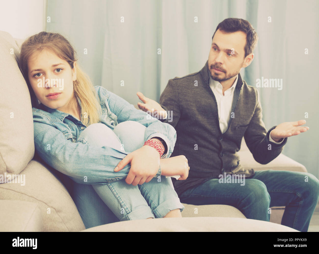 Young father arguing with his teenage daughter at home Stock Photo - Alamy