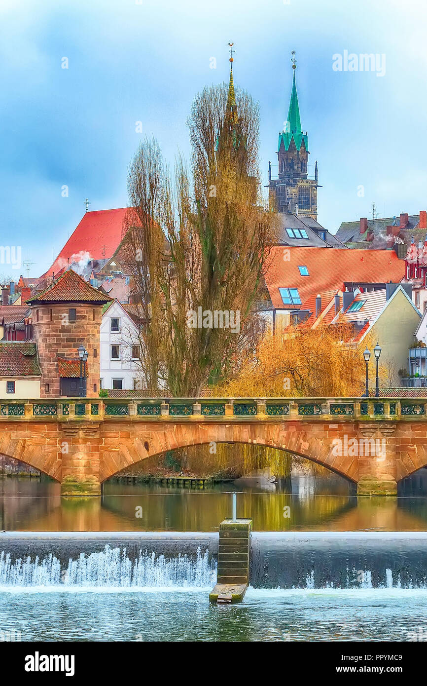 Old buildings, cathedral tower and bridge over the river in Nuremberg ...