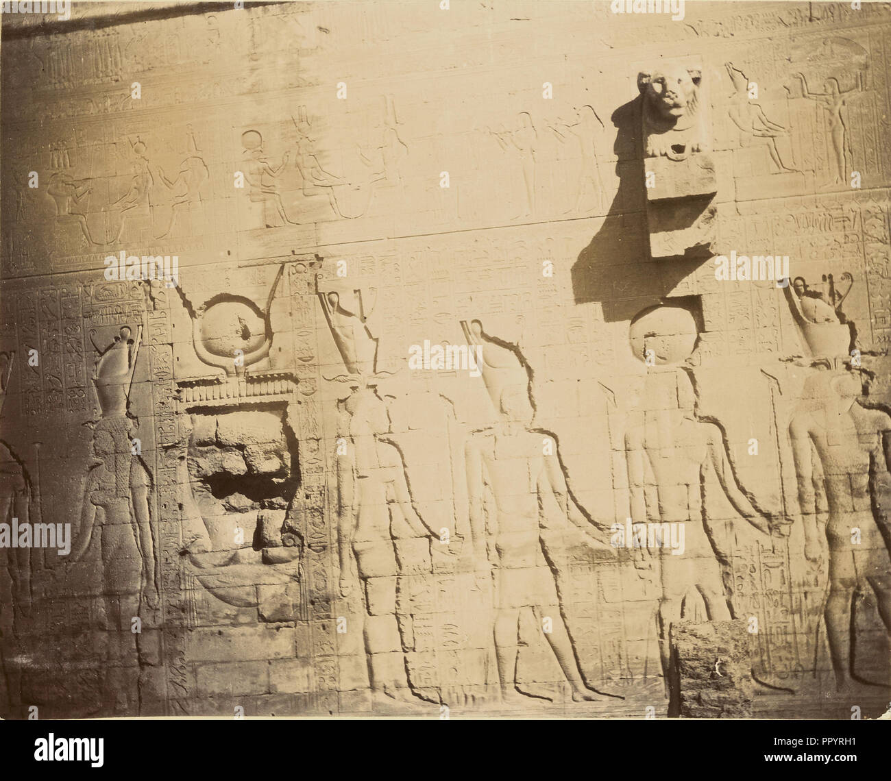 Wall with relief sculptures of ancient Egyptian figures; Egypt; about ...