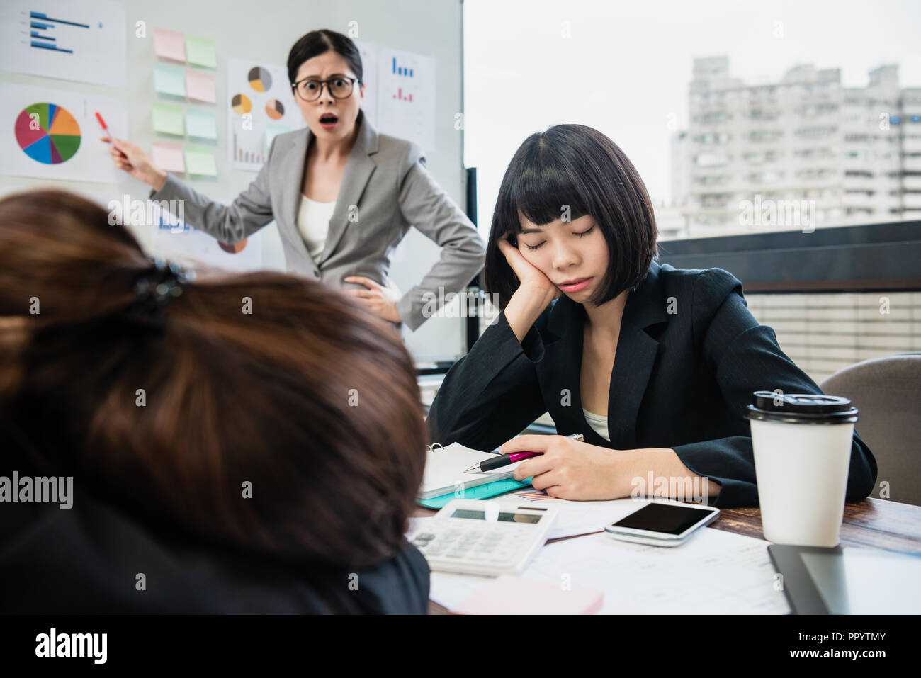The Businesswoman Is Yelling At Her Colleagues Who Doze Off In The The Businesswoman Is Yelling At Her Colleagues Who Doze Off In The