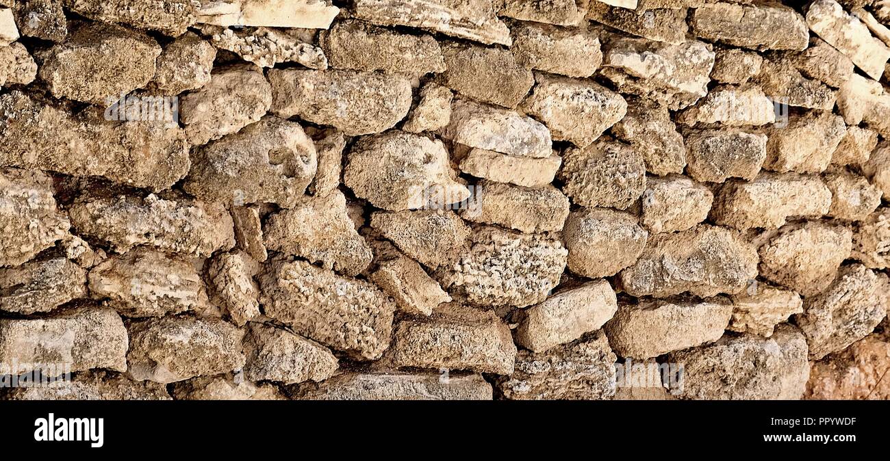 Stone Wall background from very old building contruction facade Stock ...